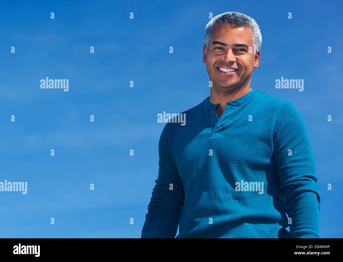 Mixed race man smiling outdoors Stock Photo - Alamy