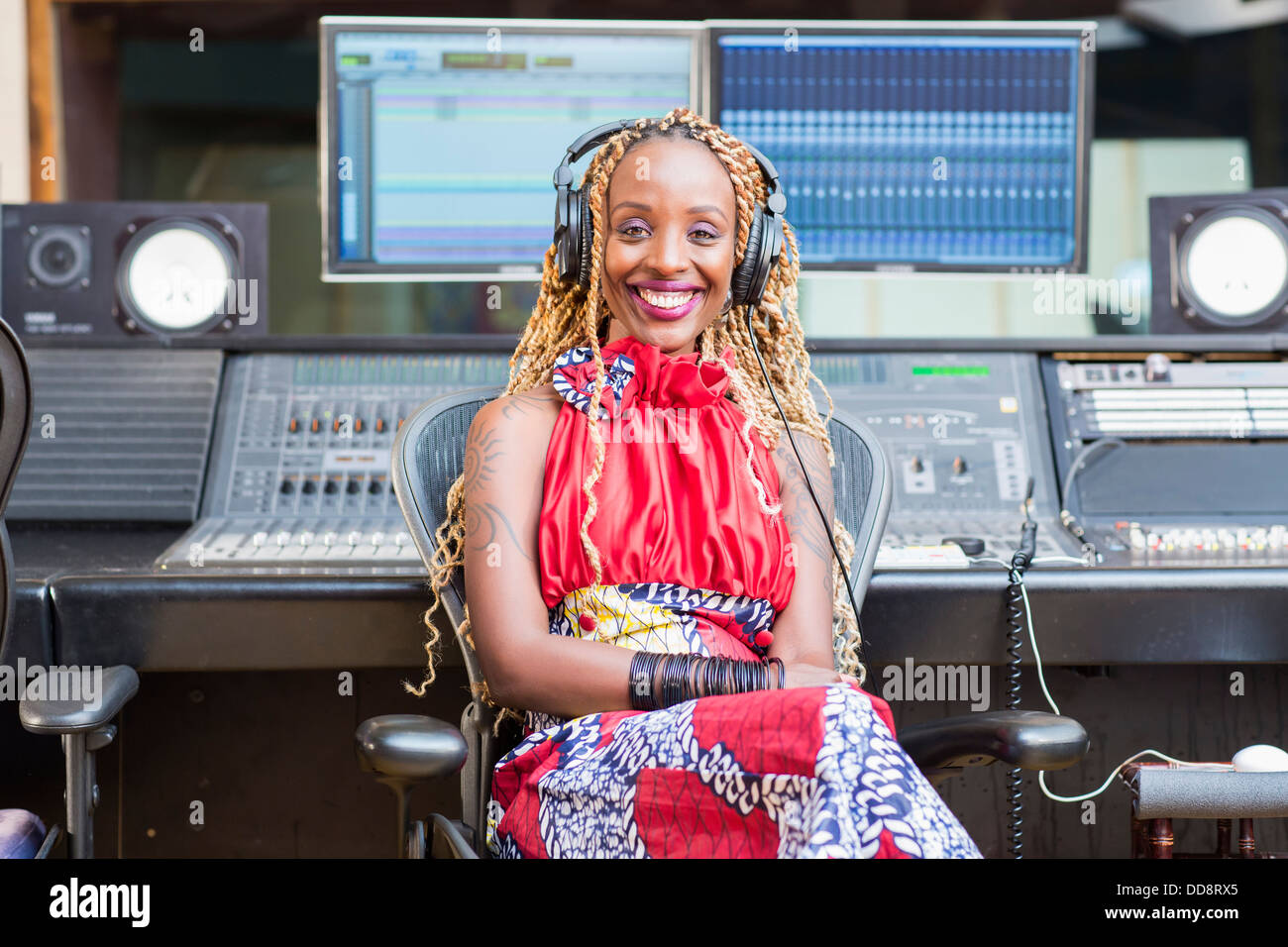 African American singer listening to track in studio Stock Photo - Alamy