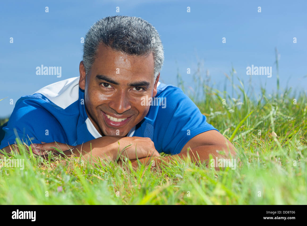 Asian man laying in grass hi-res stock photography and images - Alamy