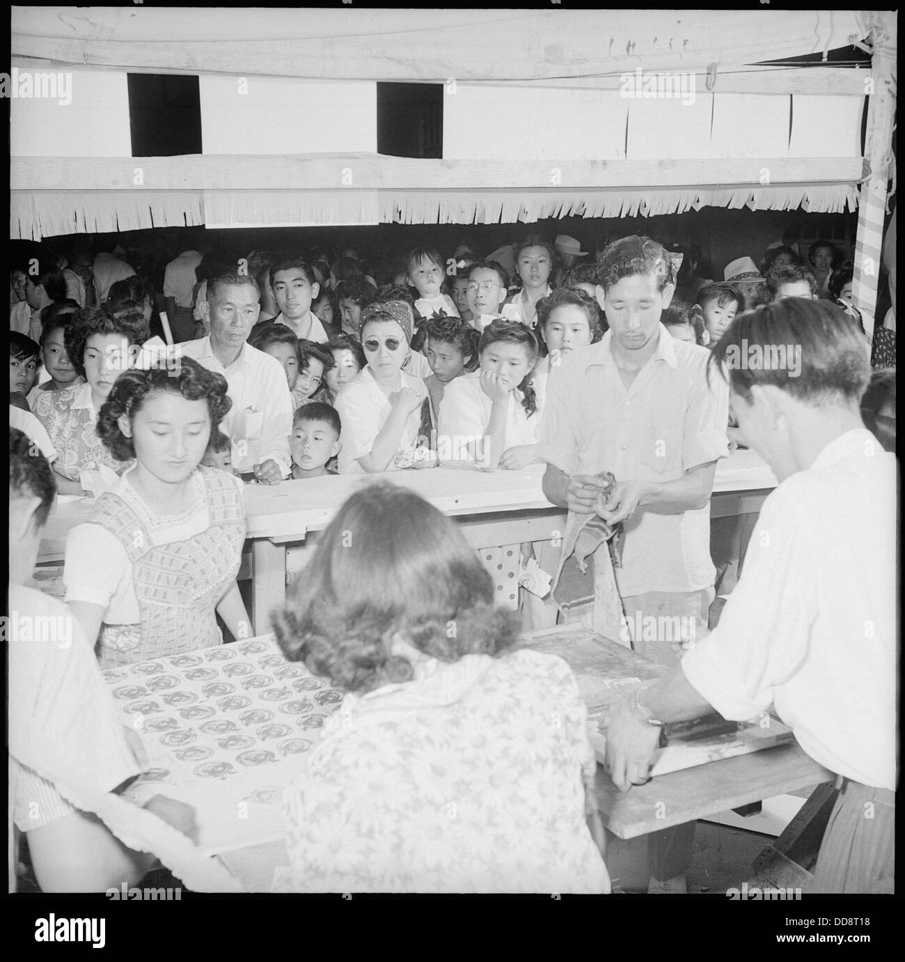 At the Granada Relocation Center, Amache, Colorado, a silk screen booth ...