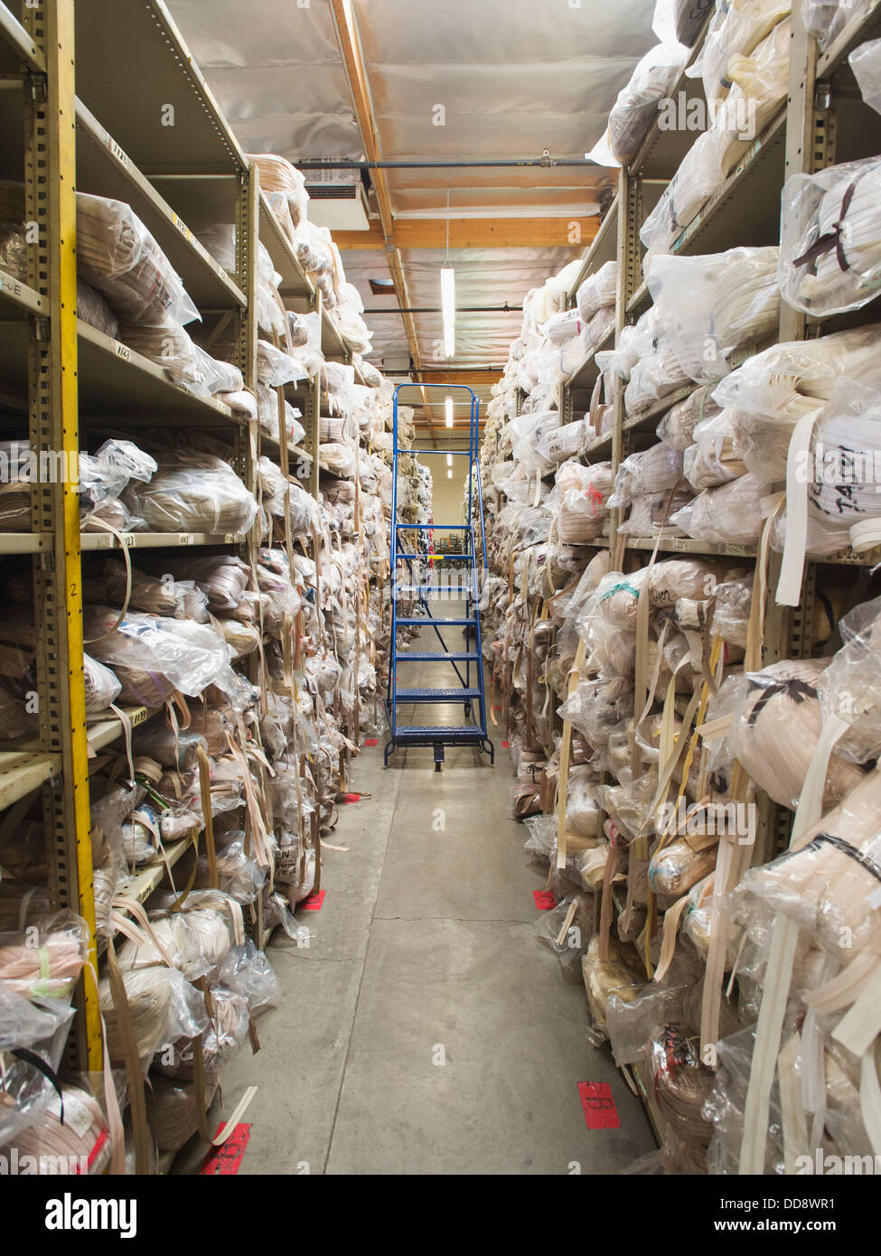 Rows of fabrics in textile factory Stock Photo - Alamy