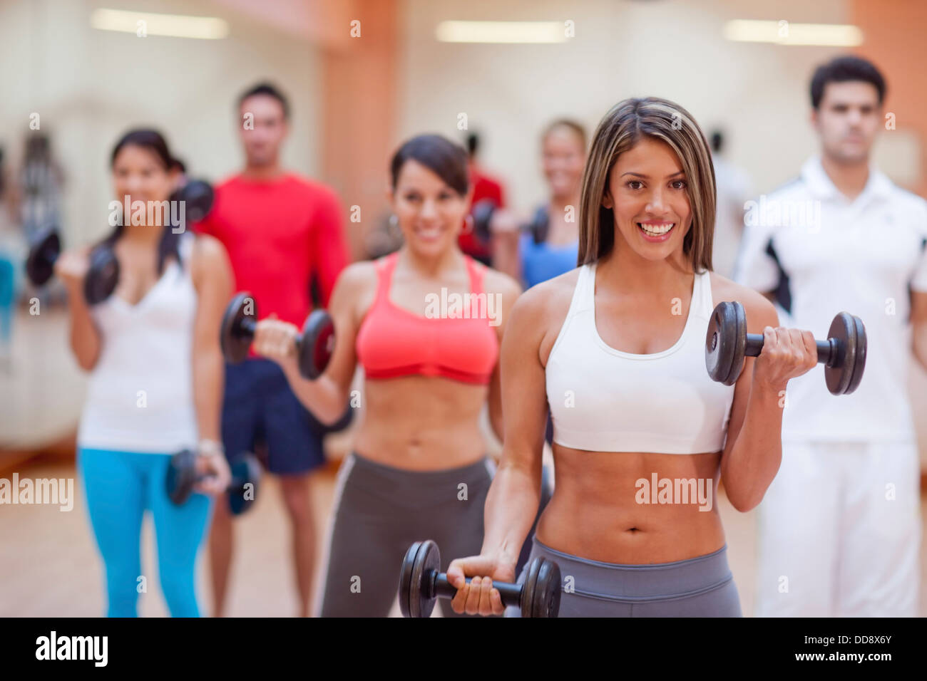 Hispanic people taking exercise class in gym Stock Photo - Alamy