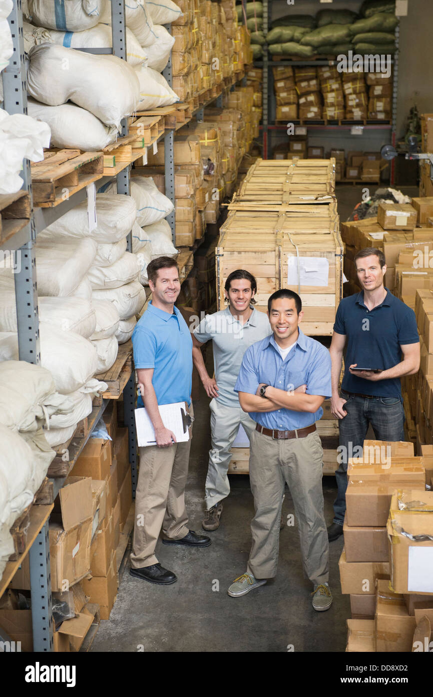 Workers smiling in textile factory Stock Photo - Alamy