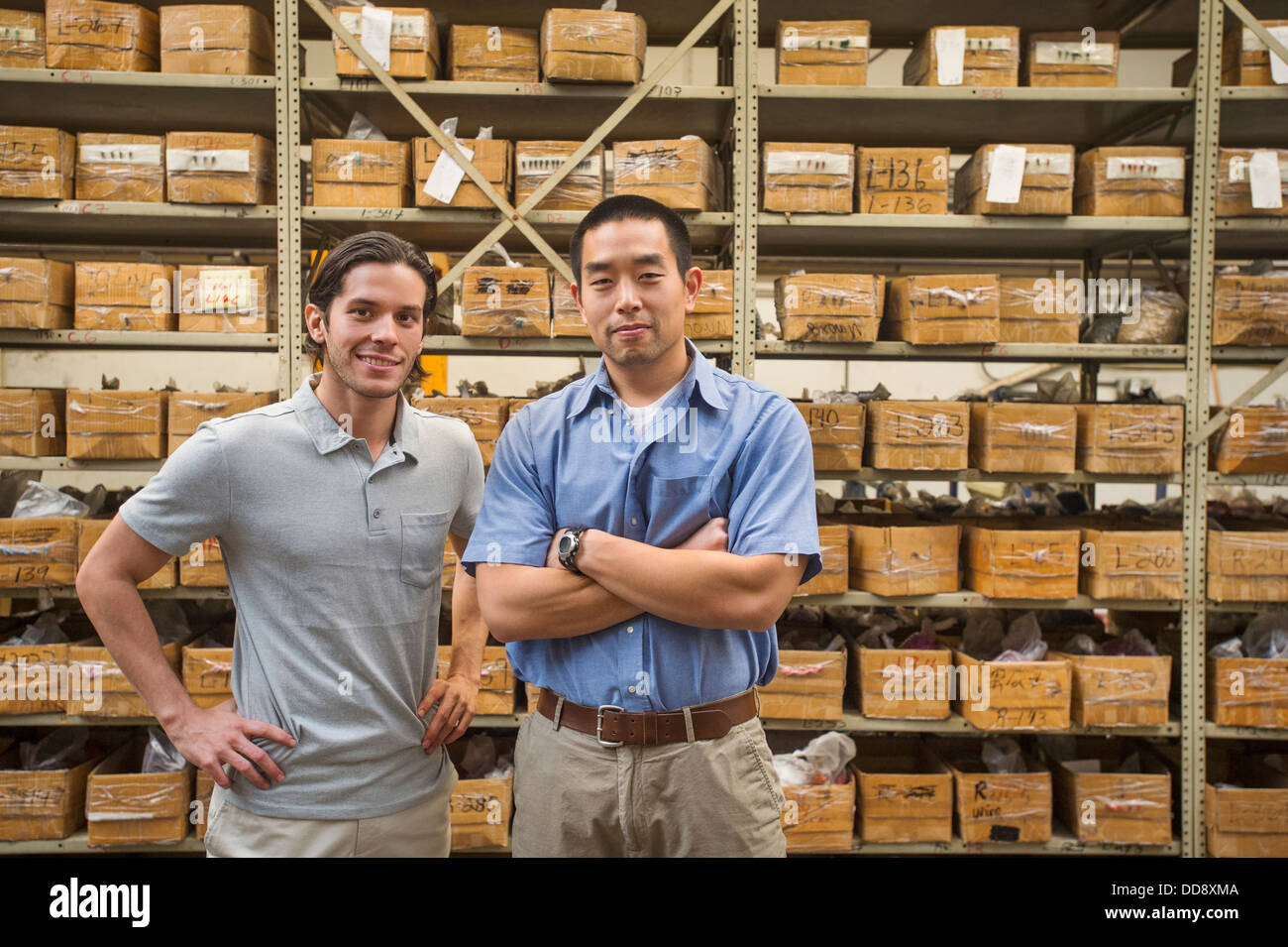 Workers smiling in textile factory Stock Photo - Alamy