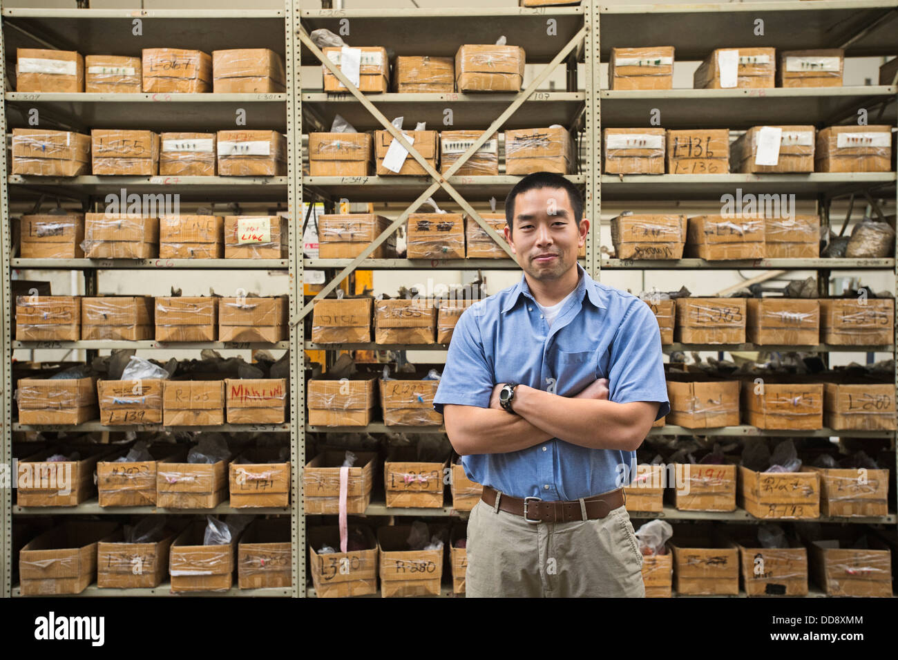 Chinese worker smiling in textile factory Stock Photo - Alamy