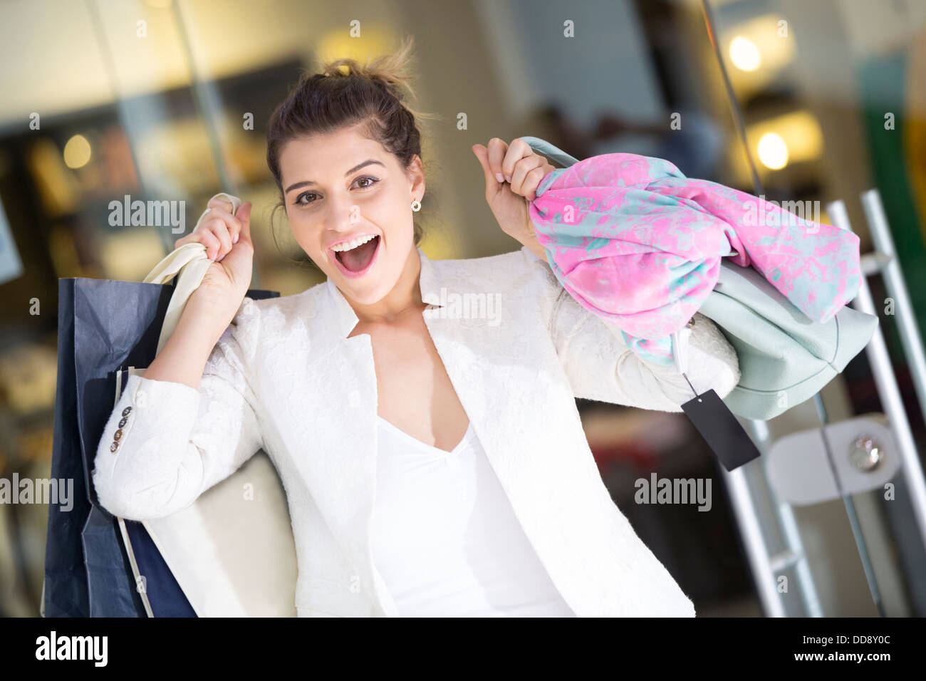 Caucasian woman shopping in mall Stock Photo - Alamy