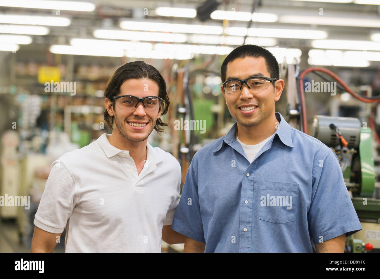 Workers smiling in textile factory Stock Photo - Alamy
