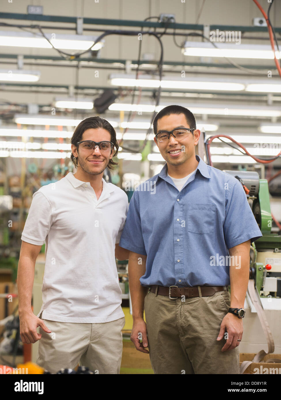 Workers smiling in textile factory Stock Photo - Alamy