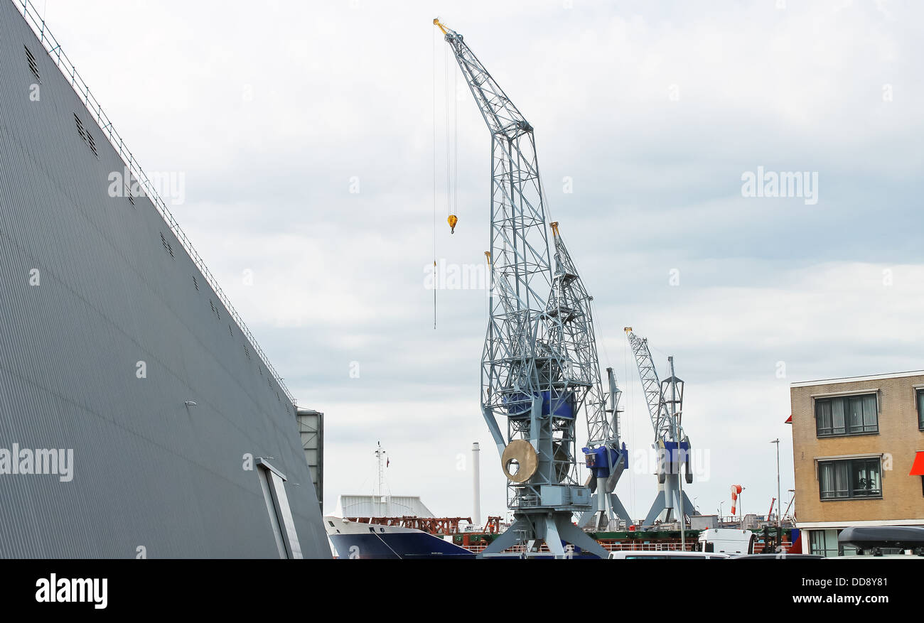 Covered dock and cranes in shipyard Stock Photo - Alamy