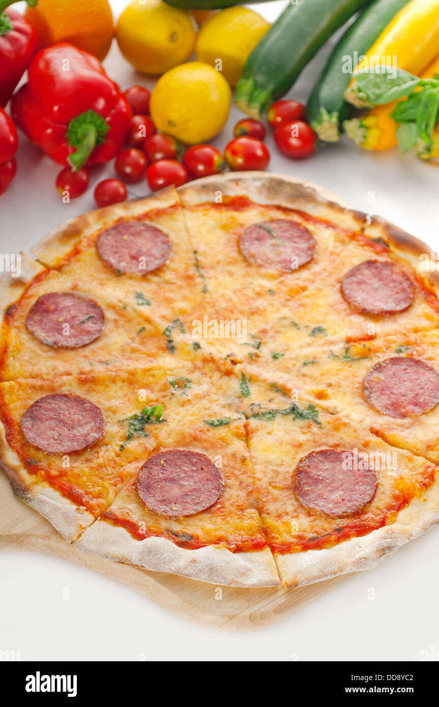 Italian original thin crust pepperoni pizza Stock Photo - Alamy