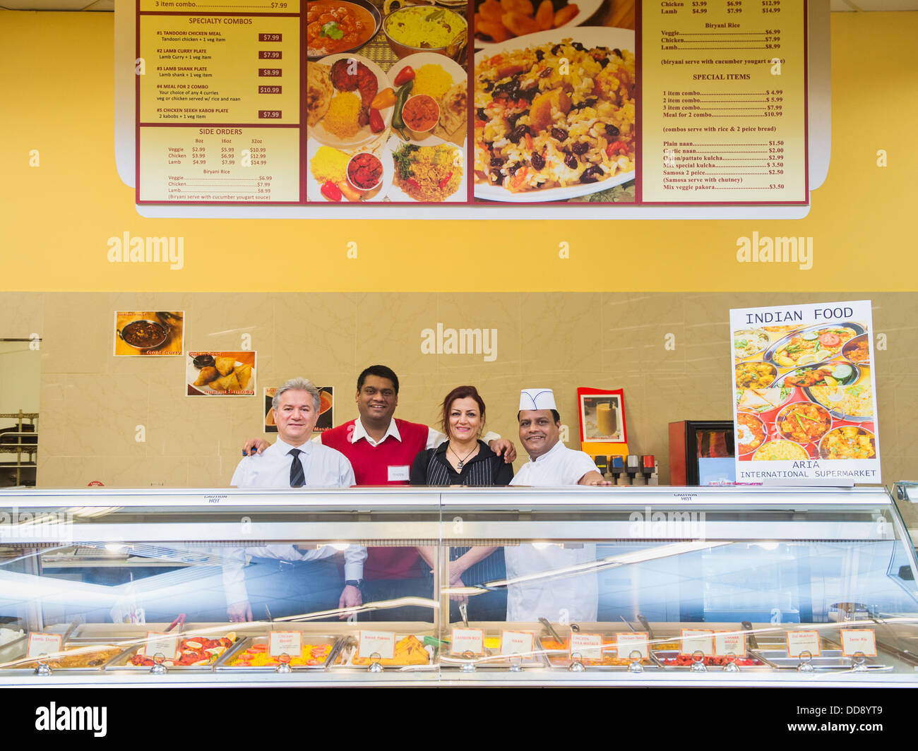 Business people and chefs behind restaurant counter Stock Photo - Alamy