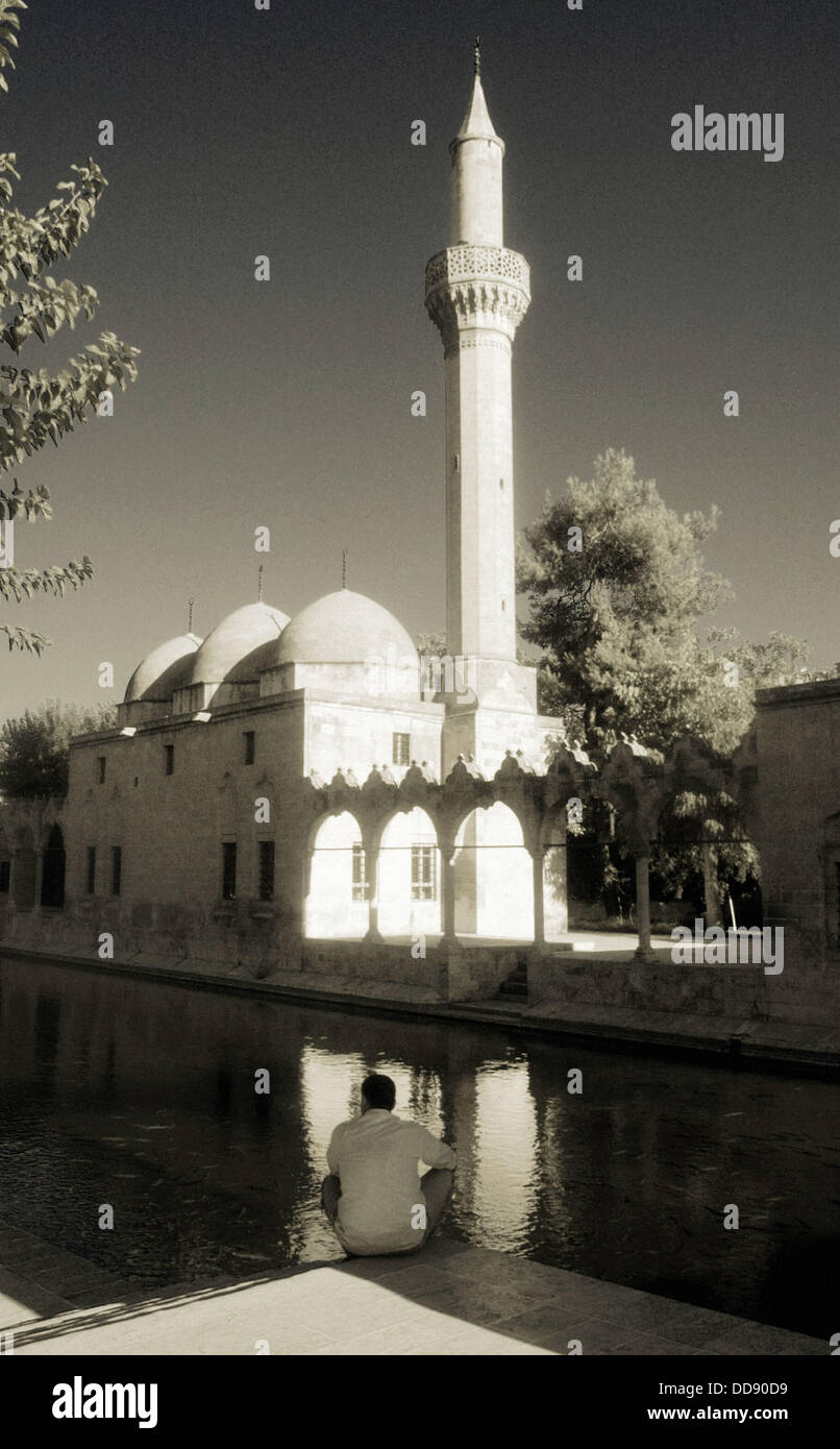 Mosque minaret and ceremonial pools of Sanli Urfa castle. Anatolia ...