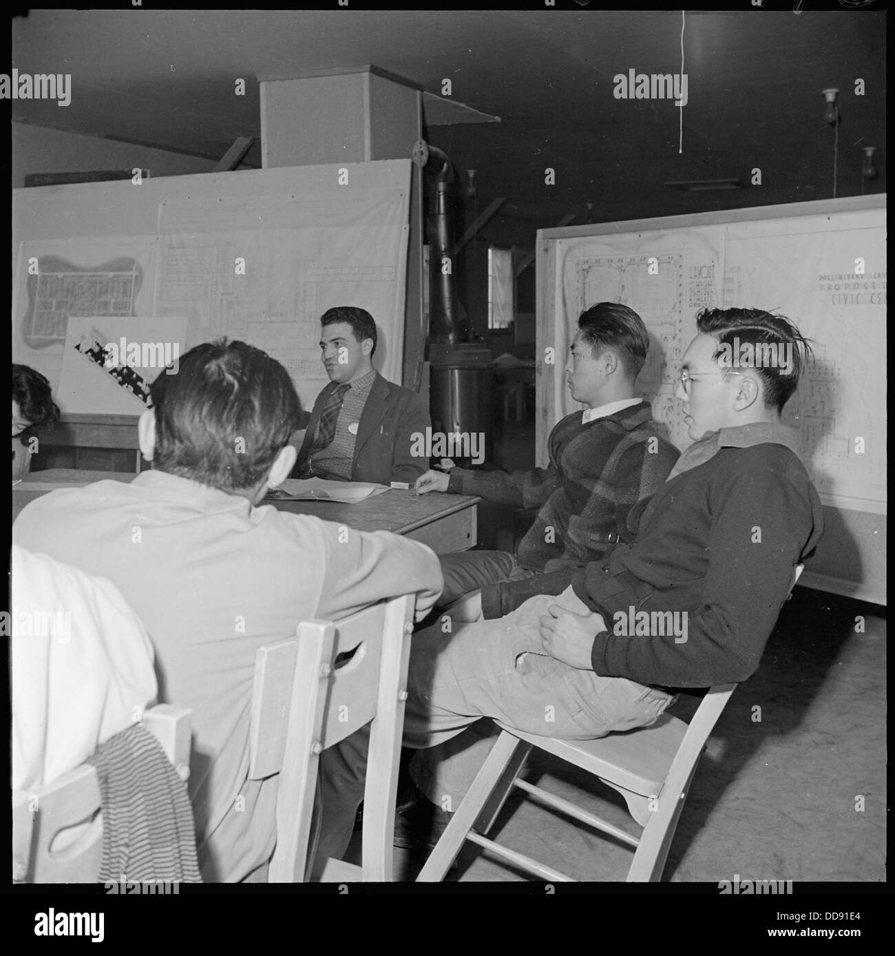 This photograph shows a meeting at the Heart Mountain Relocation Center ...