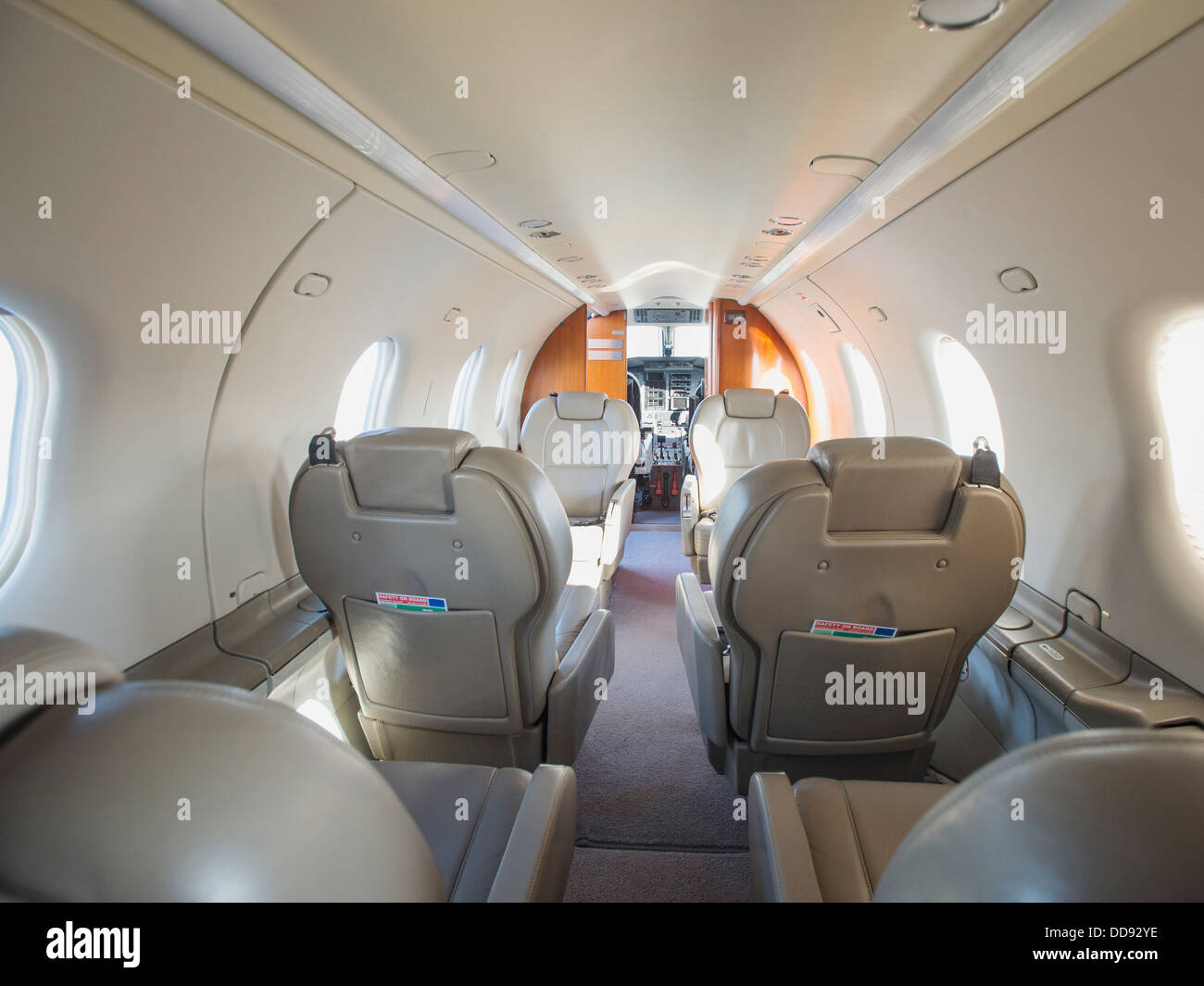 Empty seats on private jet Stock Photo - Alamy