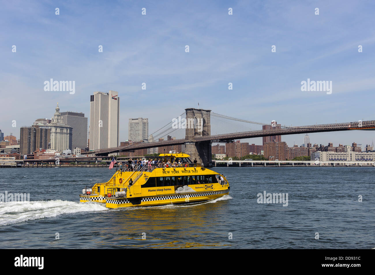 A passenger ferry, on the East River, seen from Brooklyn with New York ...