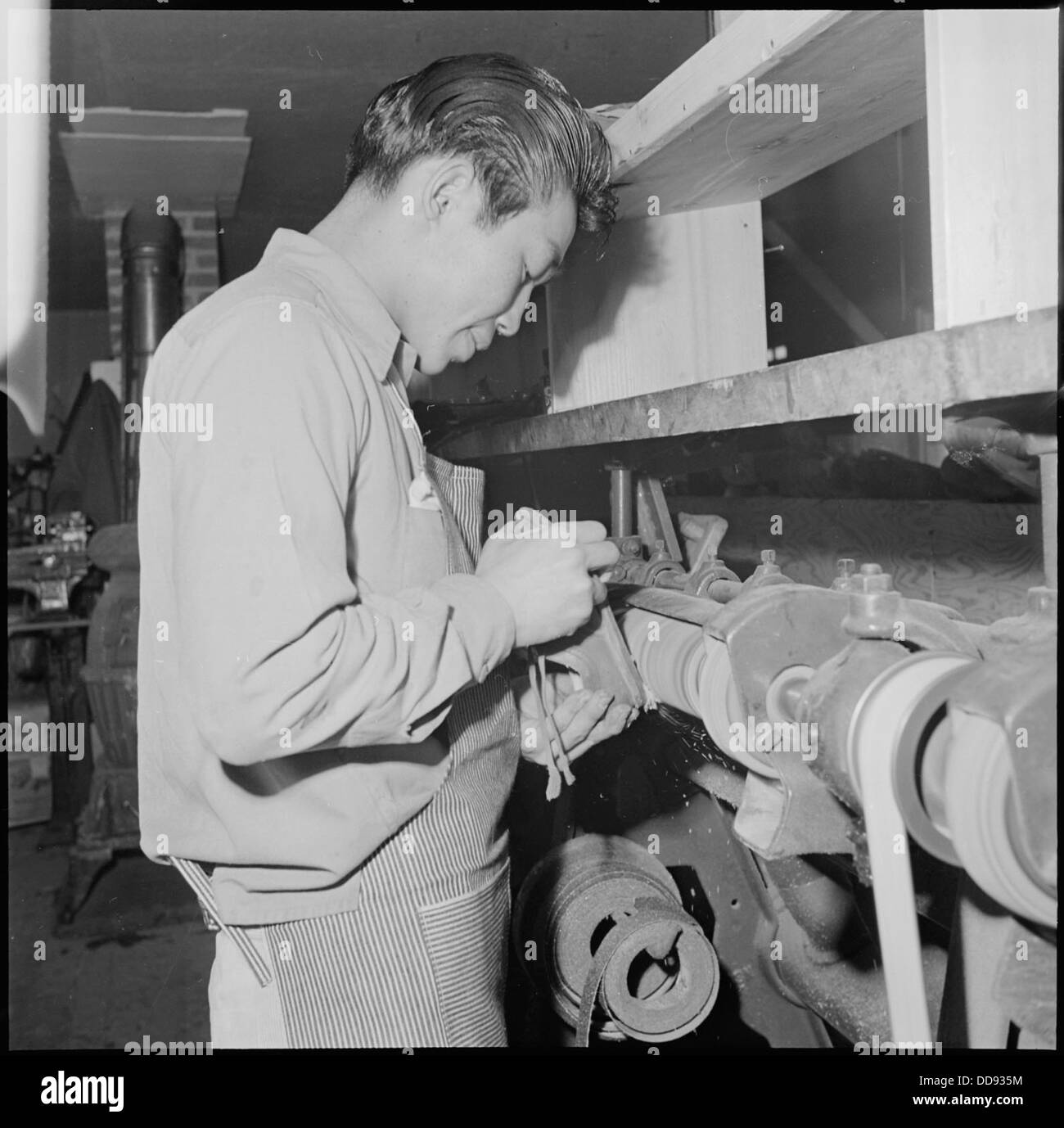 At the Heart Mountain Relocation Center in Wyoming, a shoemaker is seen ...