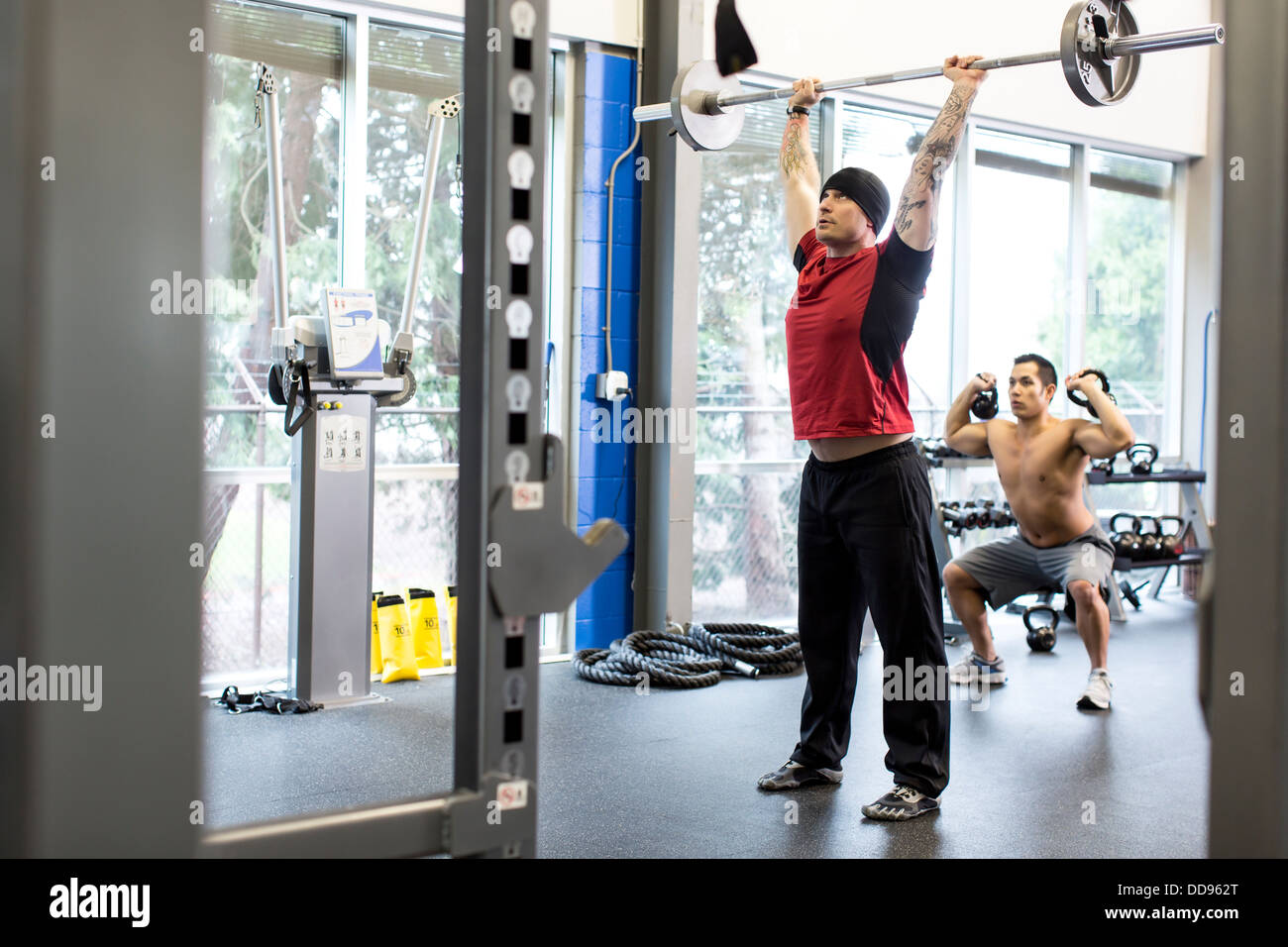 Men working out in gym Stock Photo - Alamy