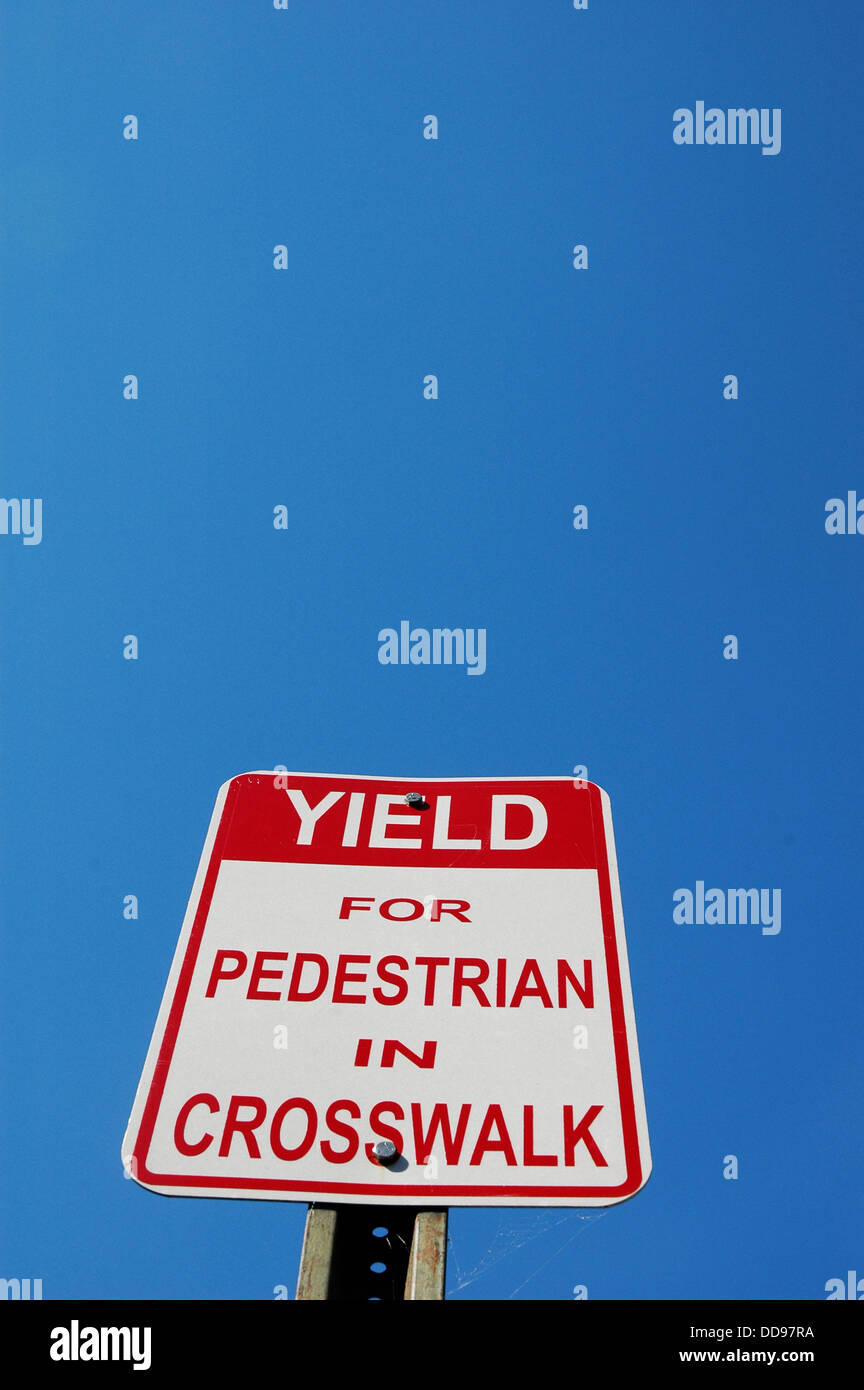 Yield for Pedestrians in Crosswalk sign on road Stock Photo - Alamy