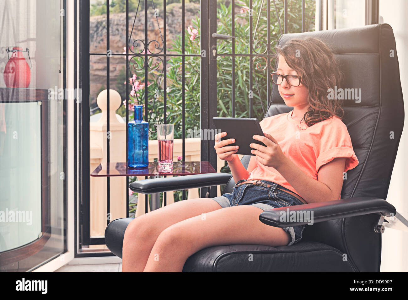 Young Girl reading Tablet Computer Stock Photo - Alamy