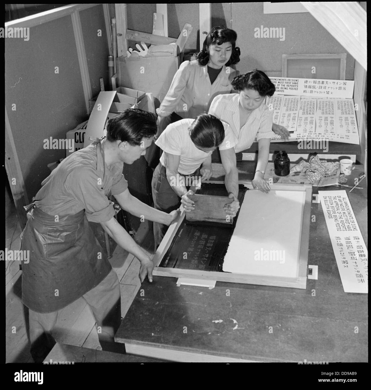 The image depicts members of the Poster Shop staff at the Heart ...