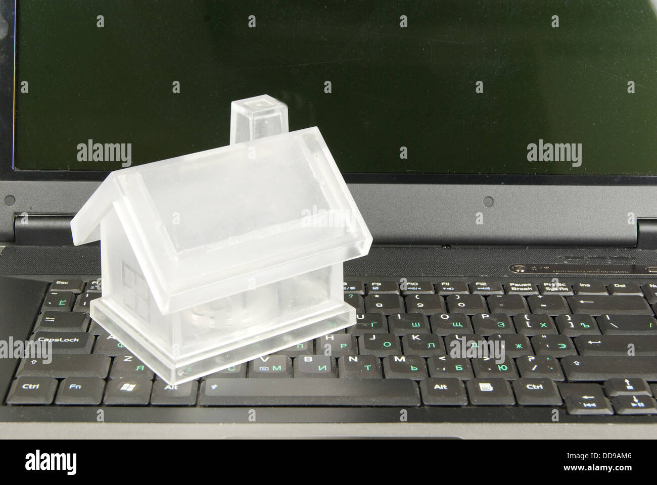 house on laptop Stock Photo - Alamy