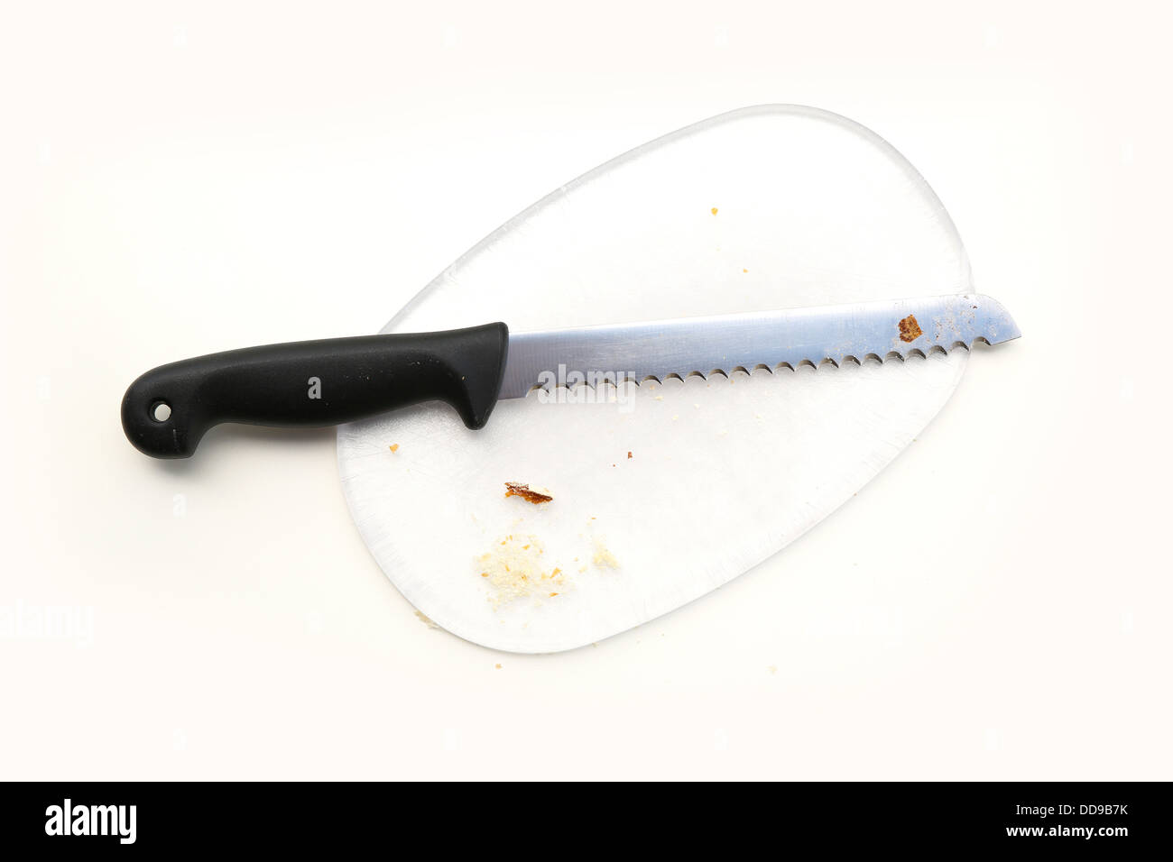 A dirty Knife and a Trencher after cutting cake Stock Photo - Alamy