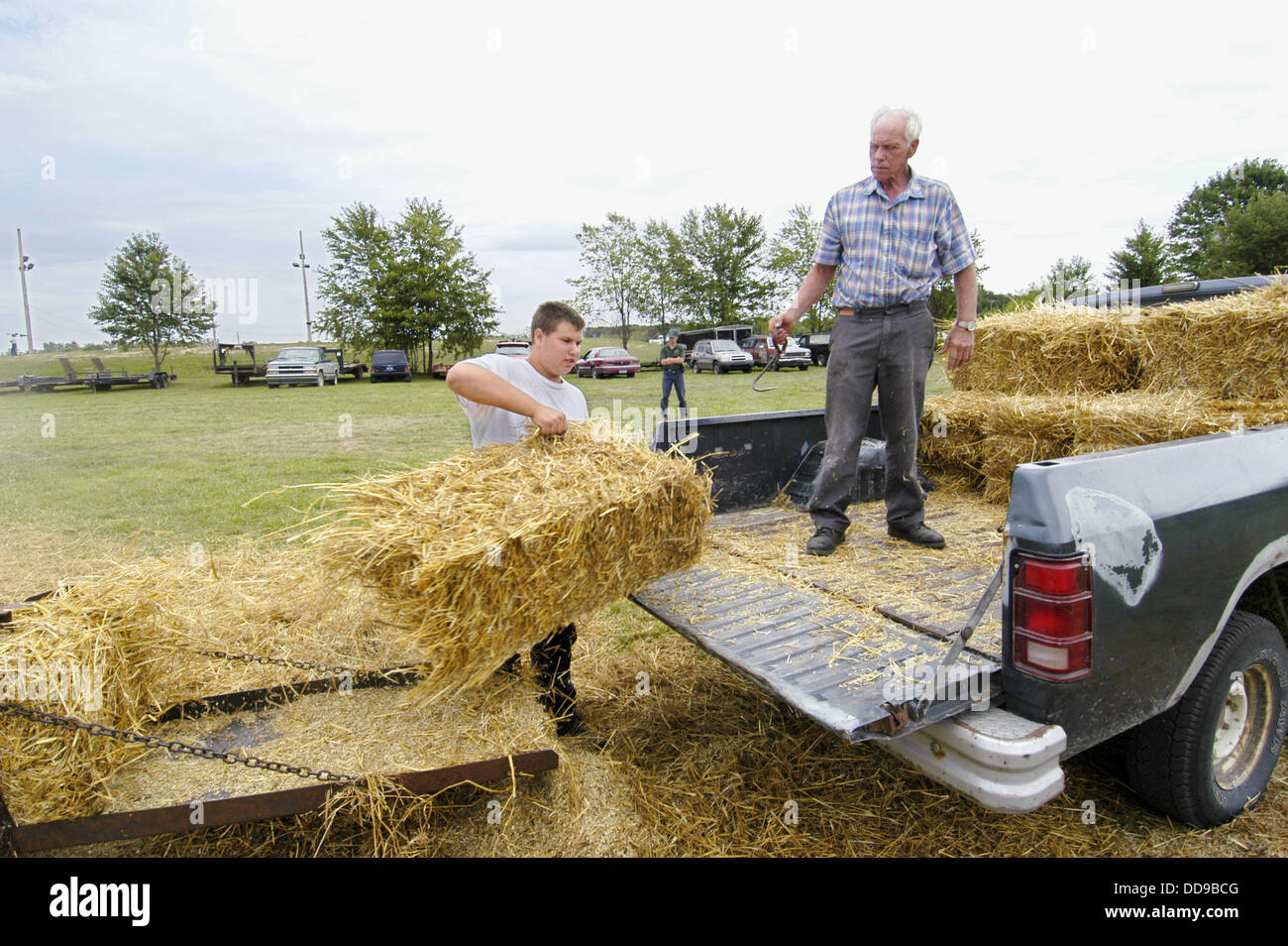 Farmers grain trashing and hay bailing methods (c. 1917) reenactment ...