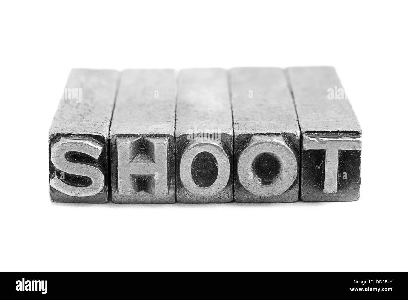 SHOOT sign, antique metal letter type Stock Photo - Alamy