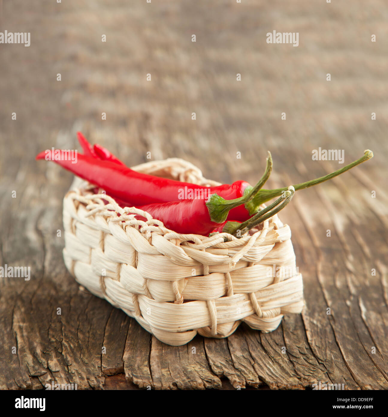 Fresh chili pepper in basket Stock Photo - Alamy