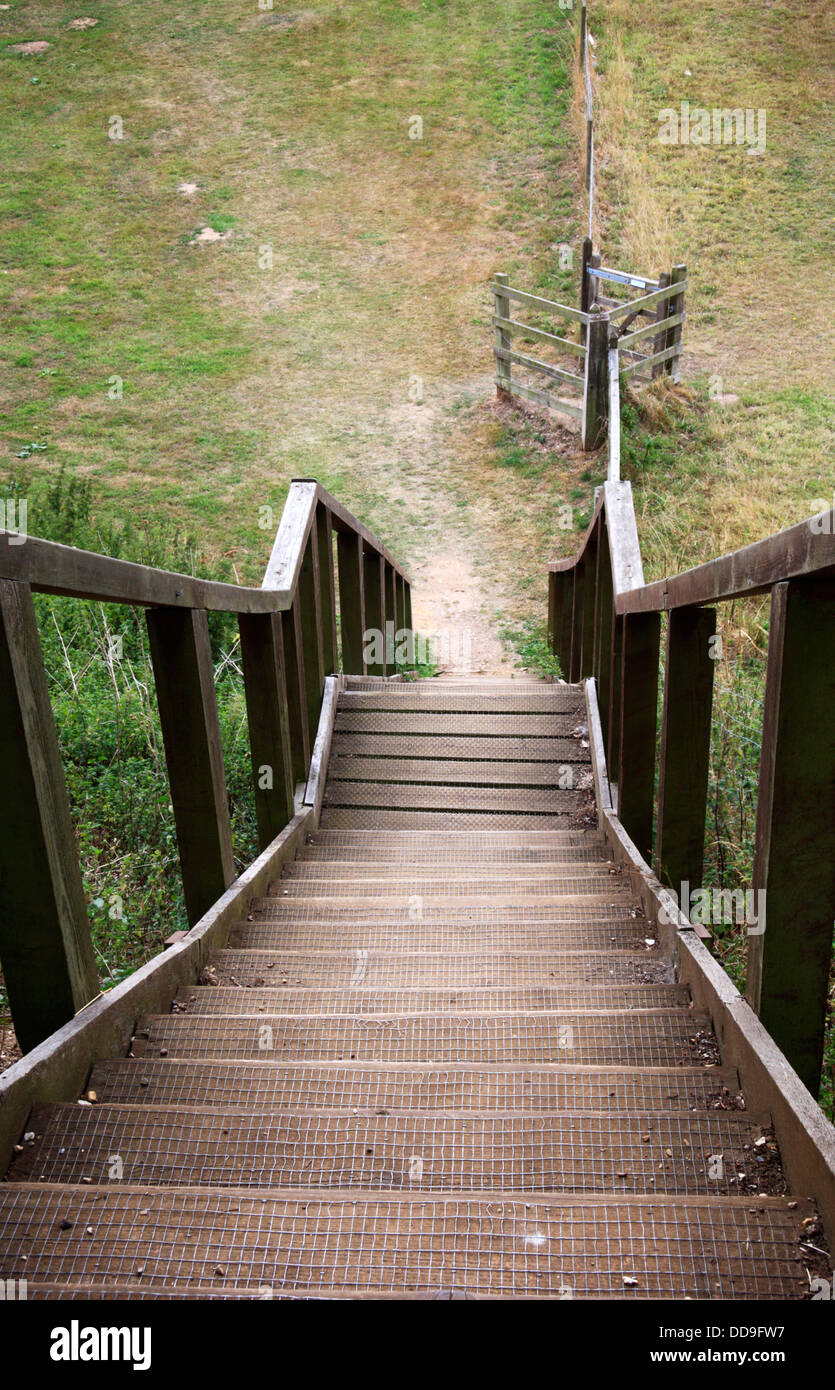 A view of a steep flight of wooden steps looking downwards from the top ...