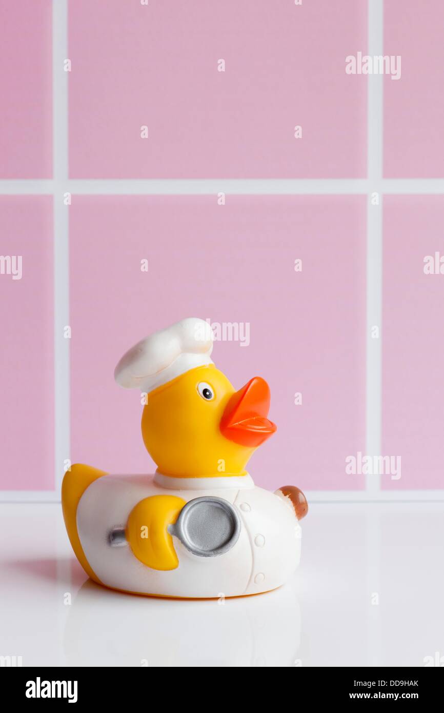 Yellow cook rubber duck with kitchen utensils Stock Photo - Alamy