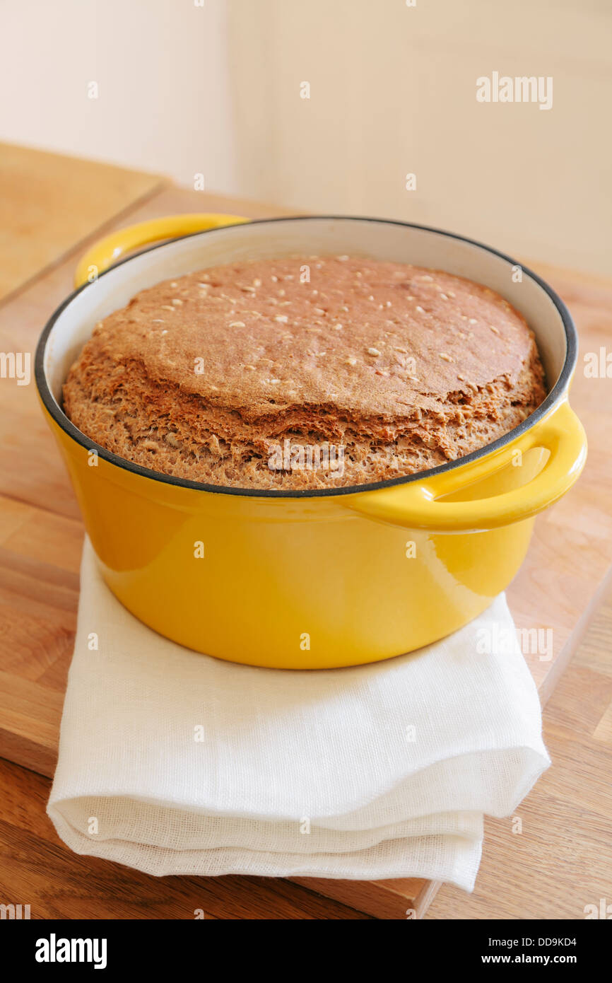 Baked bread in iron pot, close up Stock Photo - Alamy