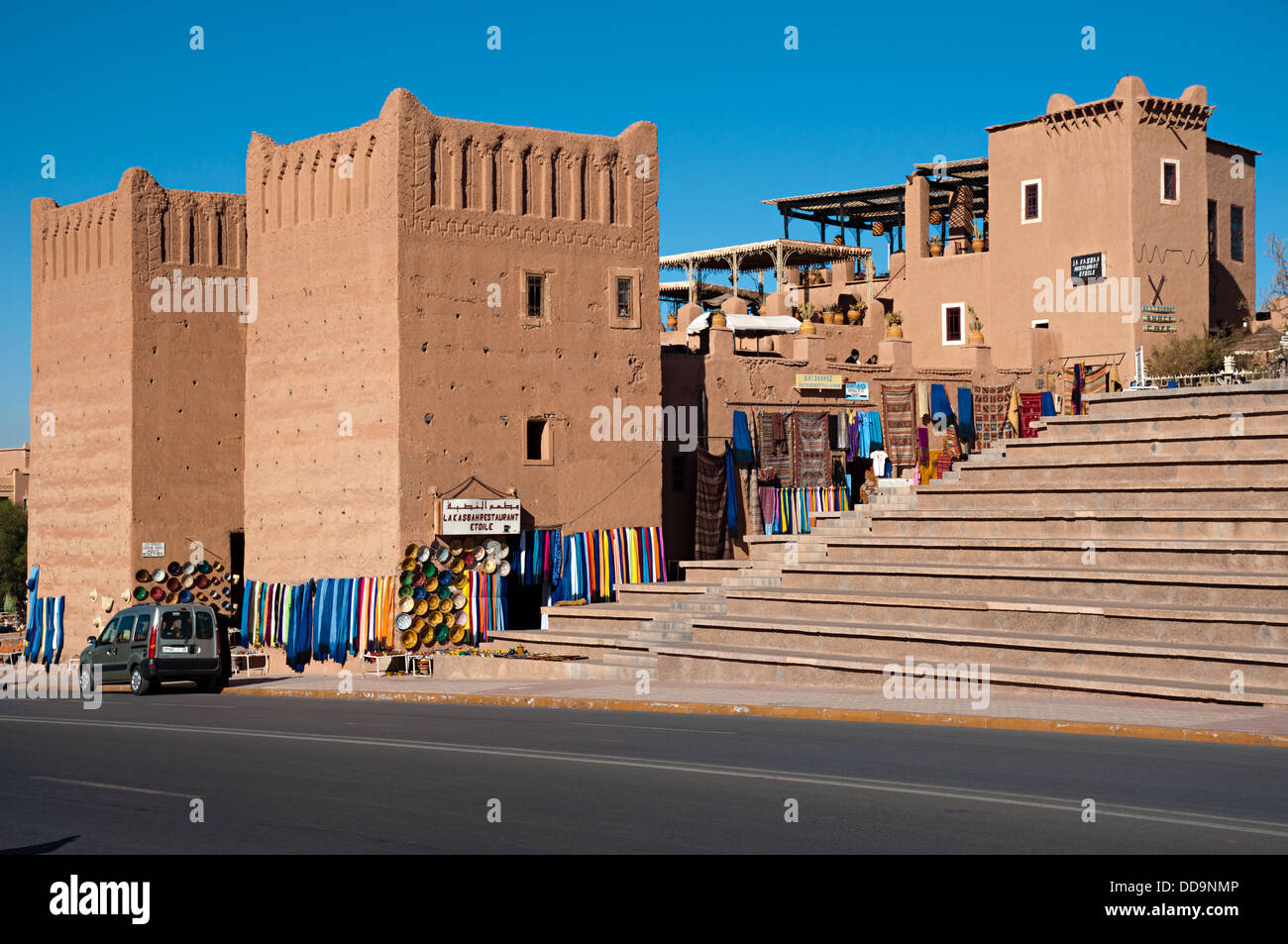 Souvenirs shops in a traditional adobe building in front of Kasbah ...