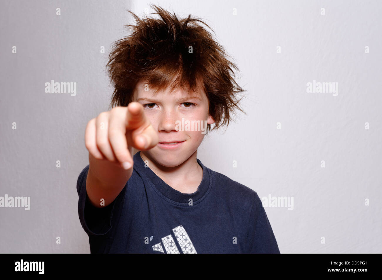 France, Boy standing and pointing out Stock Photo - Alamy