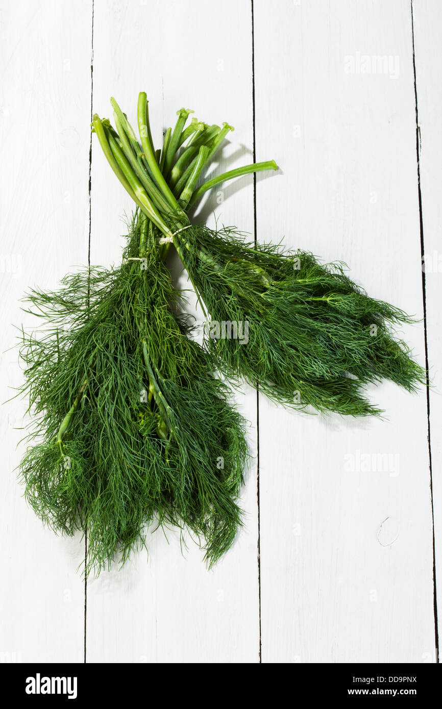 Bunch of fresh dill on wooden table, close up Stock Photo - Alamy
