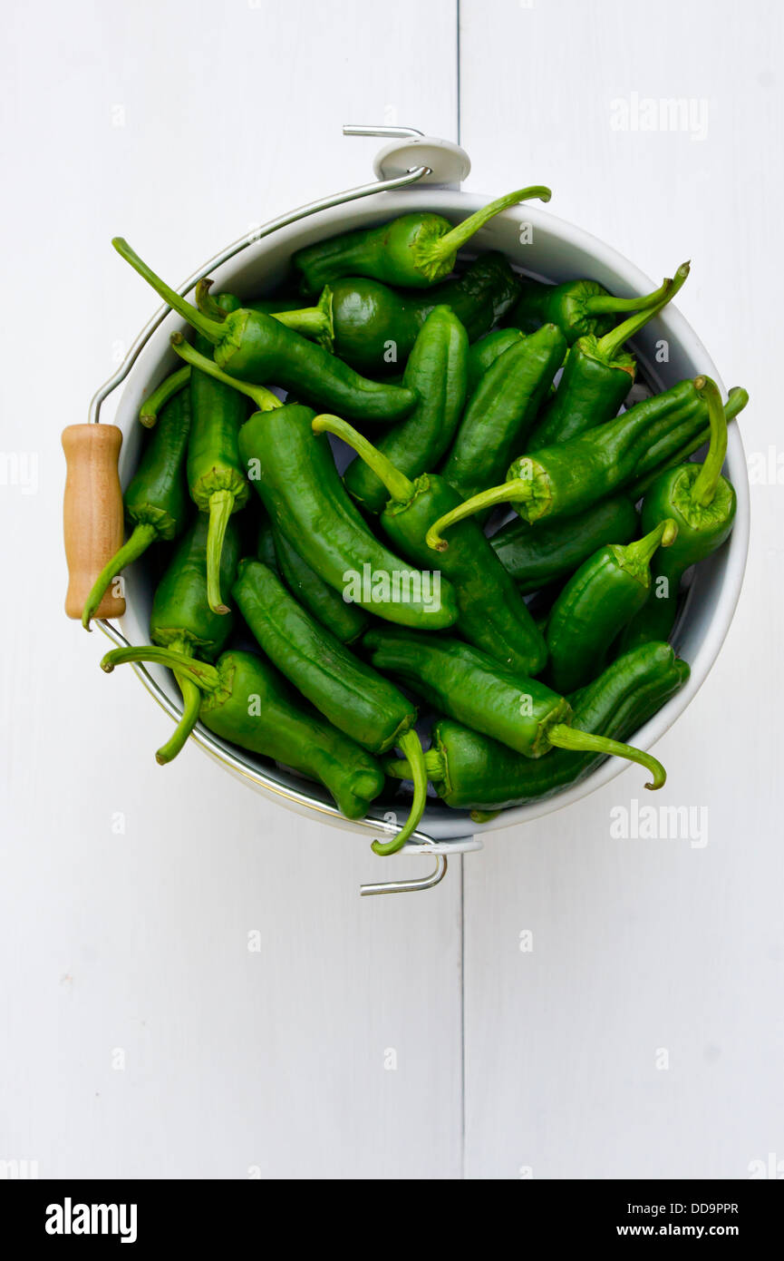 Bucket of green bell peppers on table, close up Stock Photo - Alamy