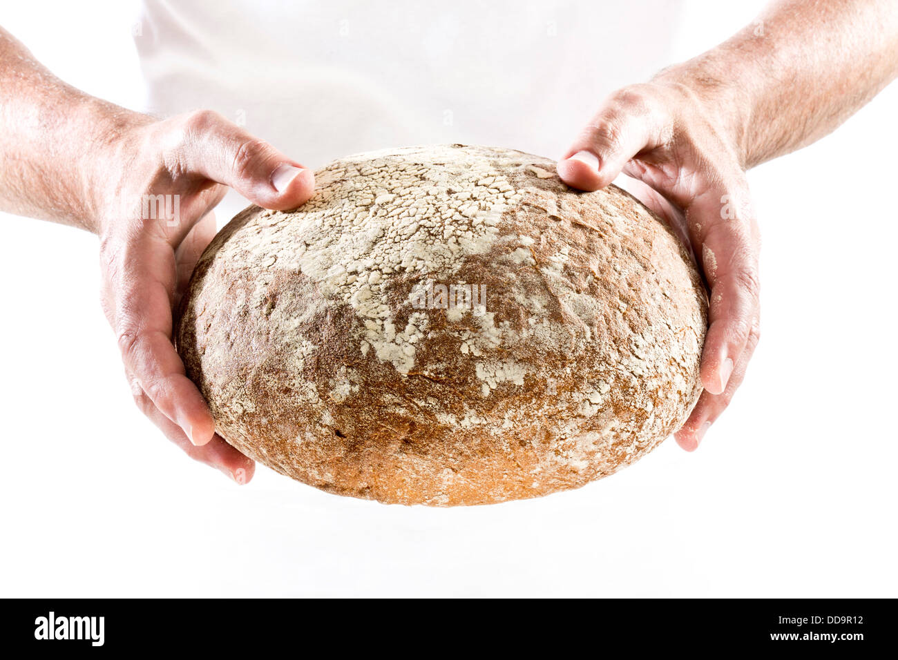 Mature man holding bread, close up Stock Photo - Alamy