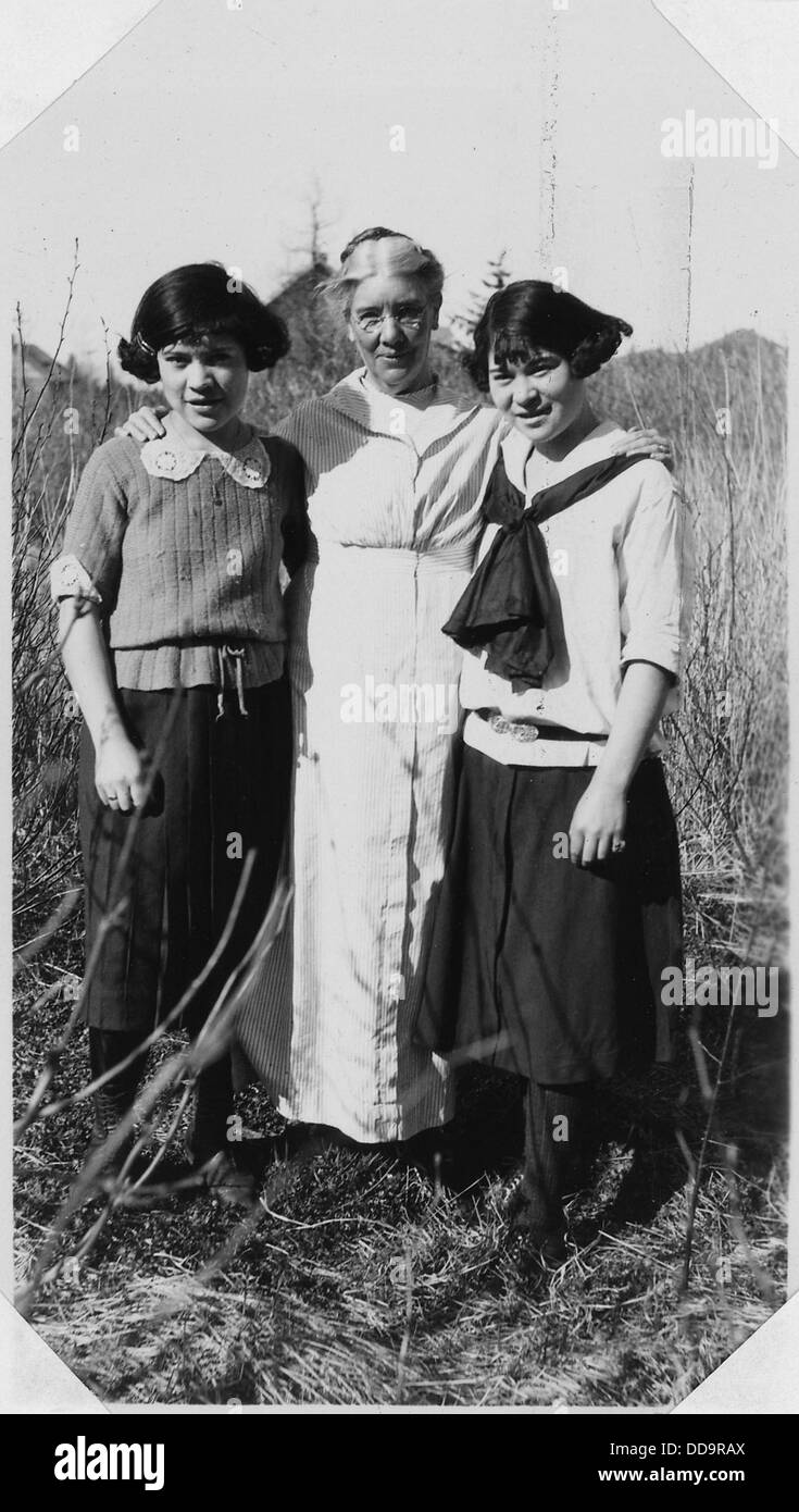 Mrs. Minthorn is pictured with two Native American girls, likely from ...