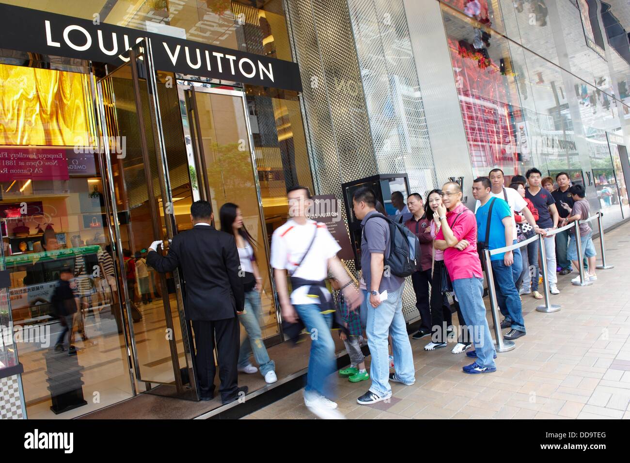 customers queue outside a louis vitton store in kowloon district hong ...