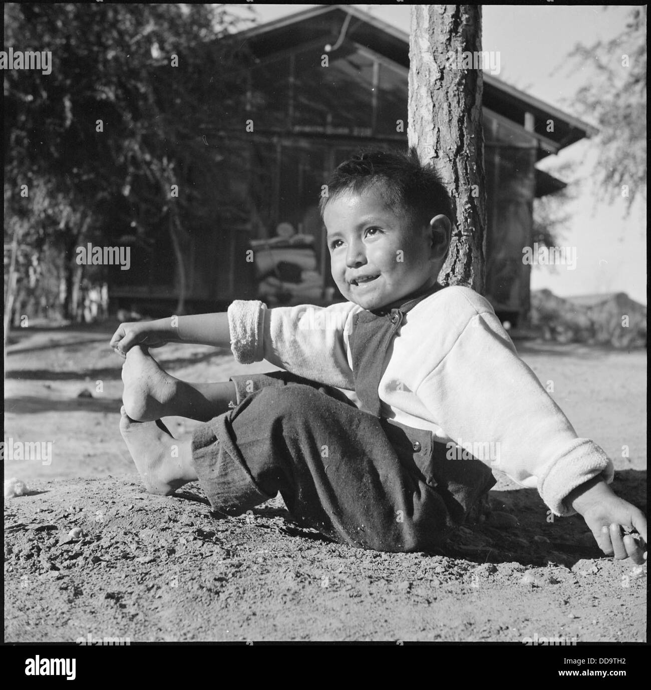 Albert Yava Jr., pictured under a tree near his new home in Poston ...