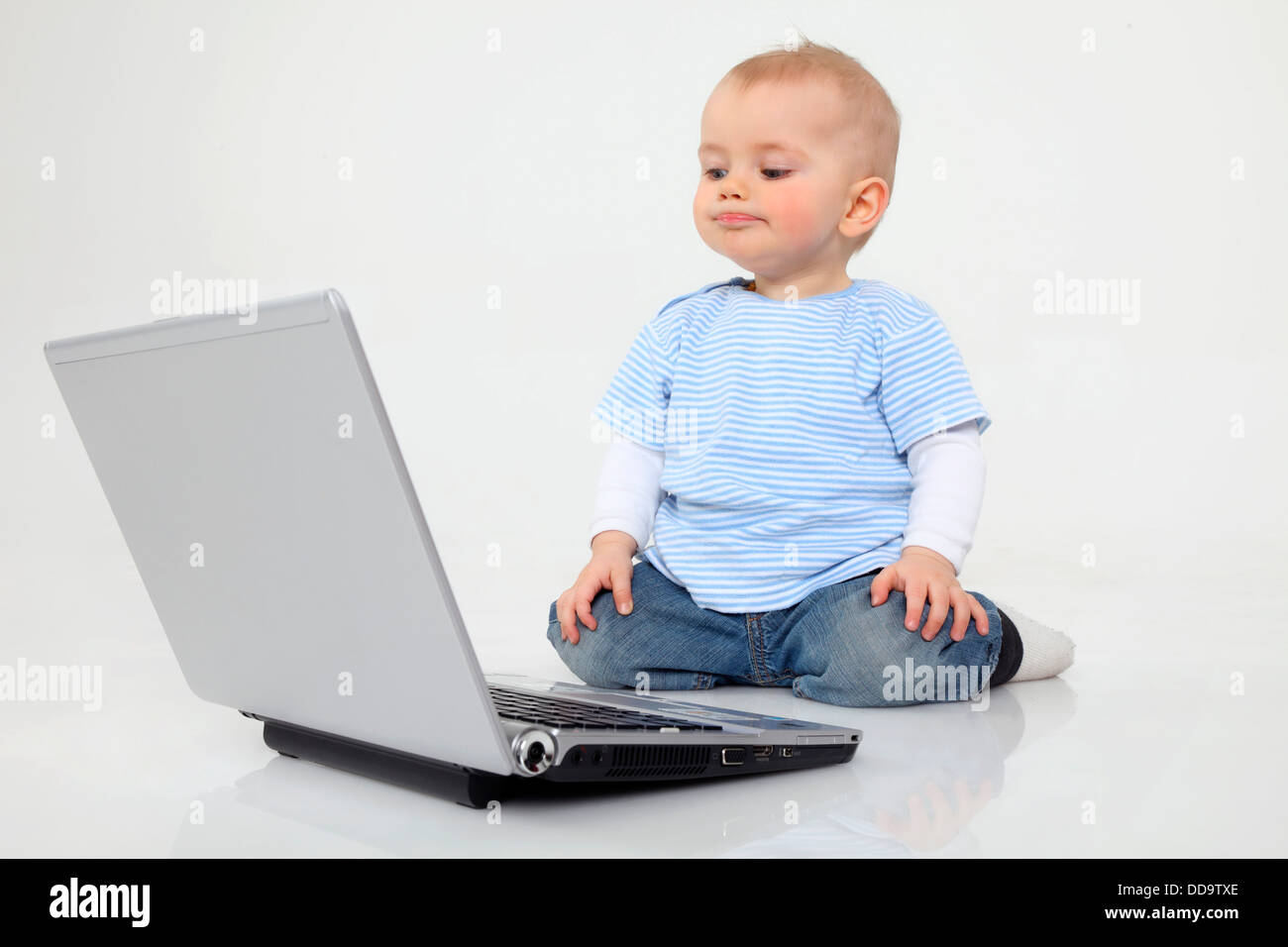 Baby boy using laptop on white background, smiling Stock Photo - Alamy