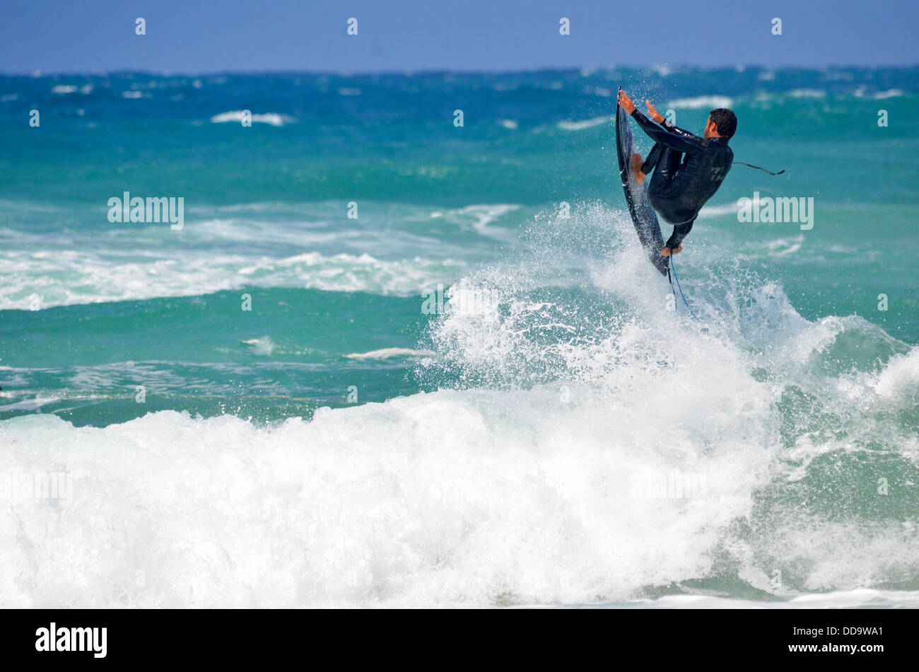 Surfer Jumps of the crest of a wave. Photographed in the Mediterranean ...
