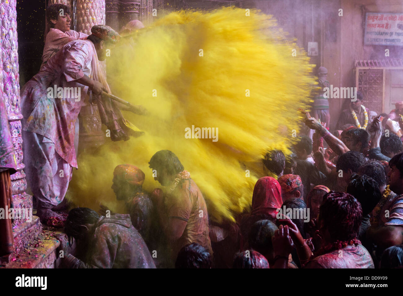 A large number of believers praying in front the image of Krishna ...