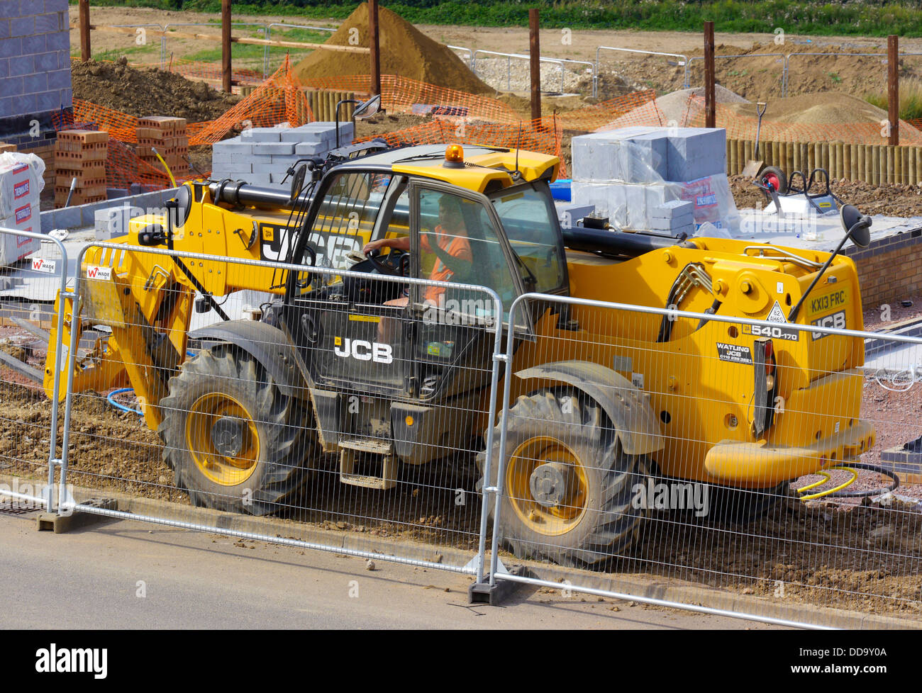 Heavy machinery being used during housing development Stock Photo - Alamy