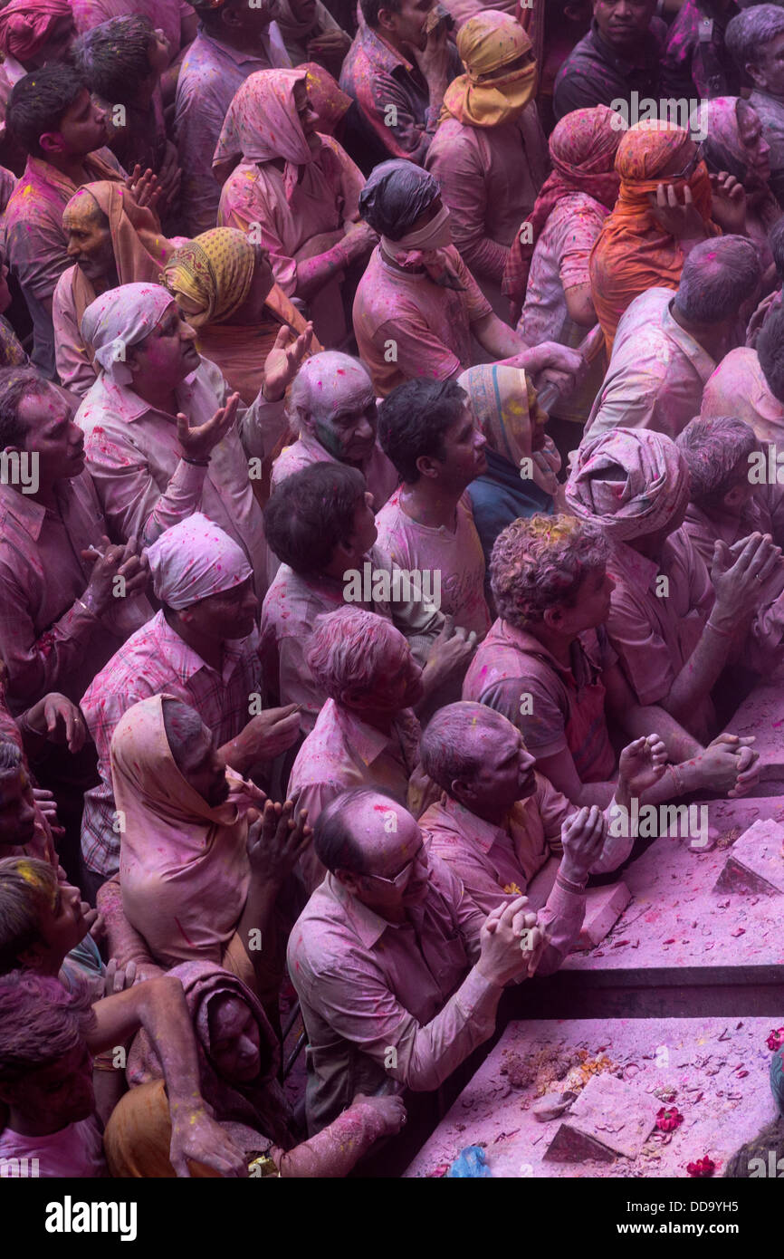 A large number of believers praying in front the image of Krishna ...