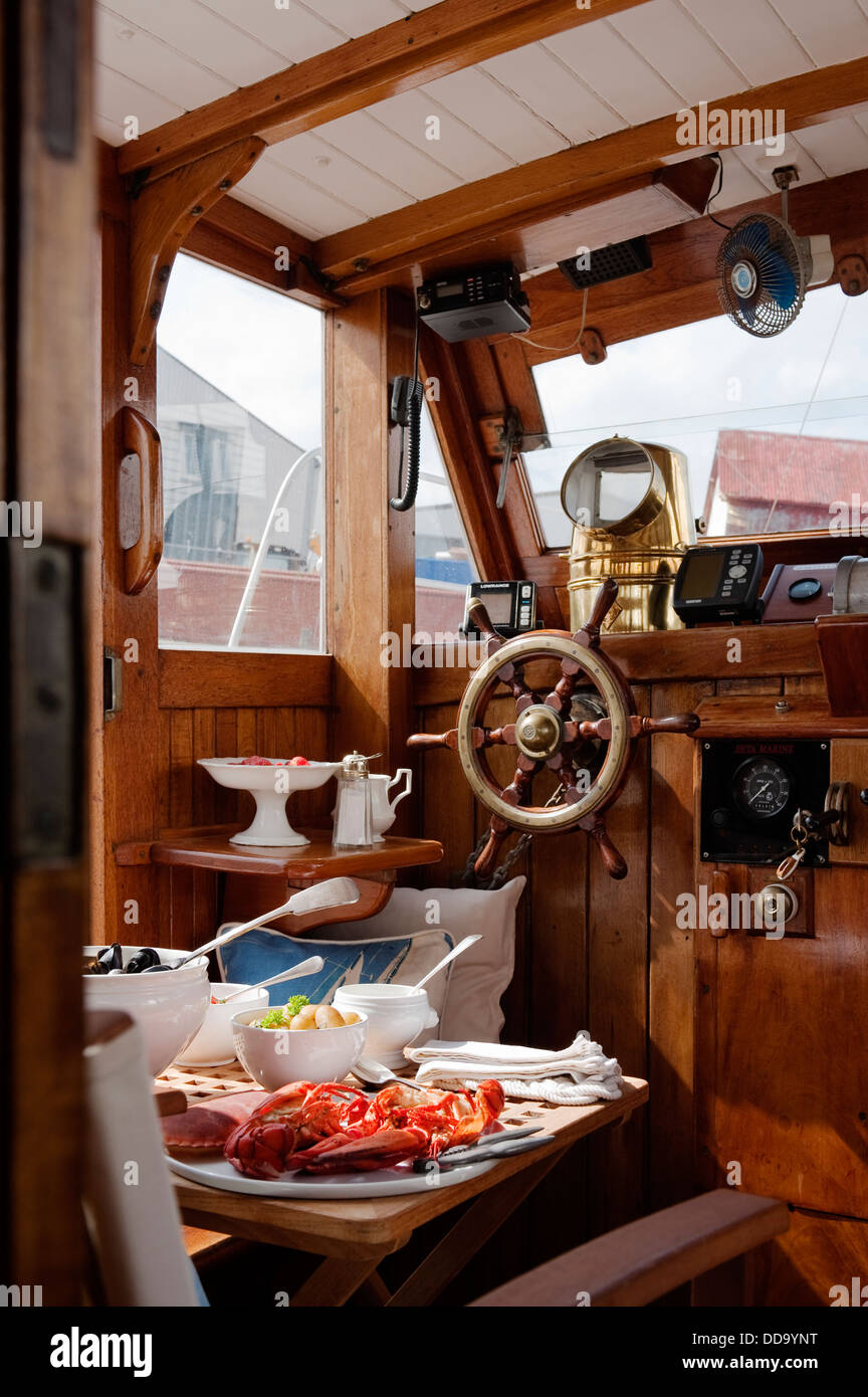 Seafood lunch in cabin interior Stock Photo - Alamy