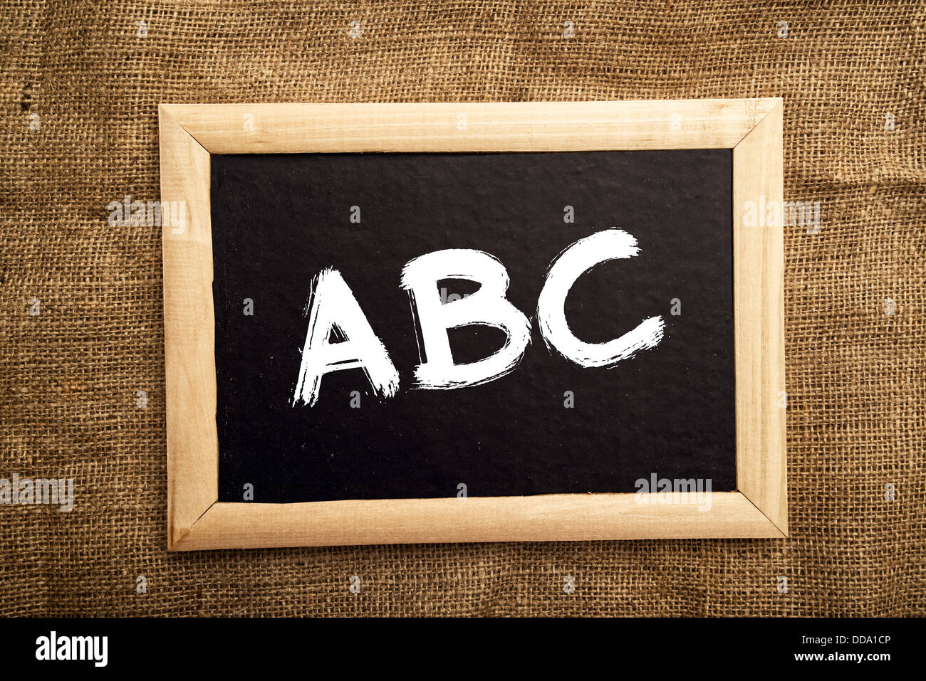 Learning ABC, letters on blackboard. Starting school and learning how ...
