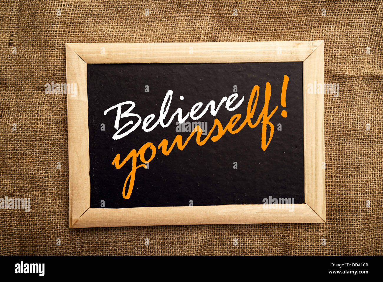 Believe yourself, motivational message on black board Stock Photo - Alamy