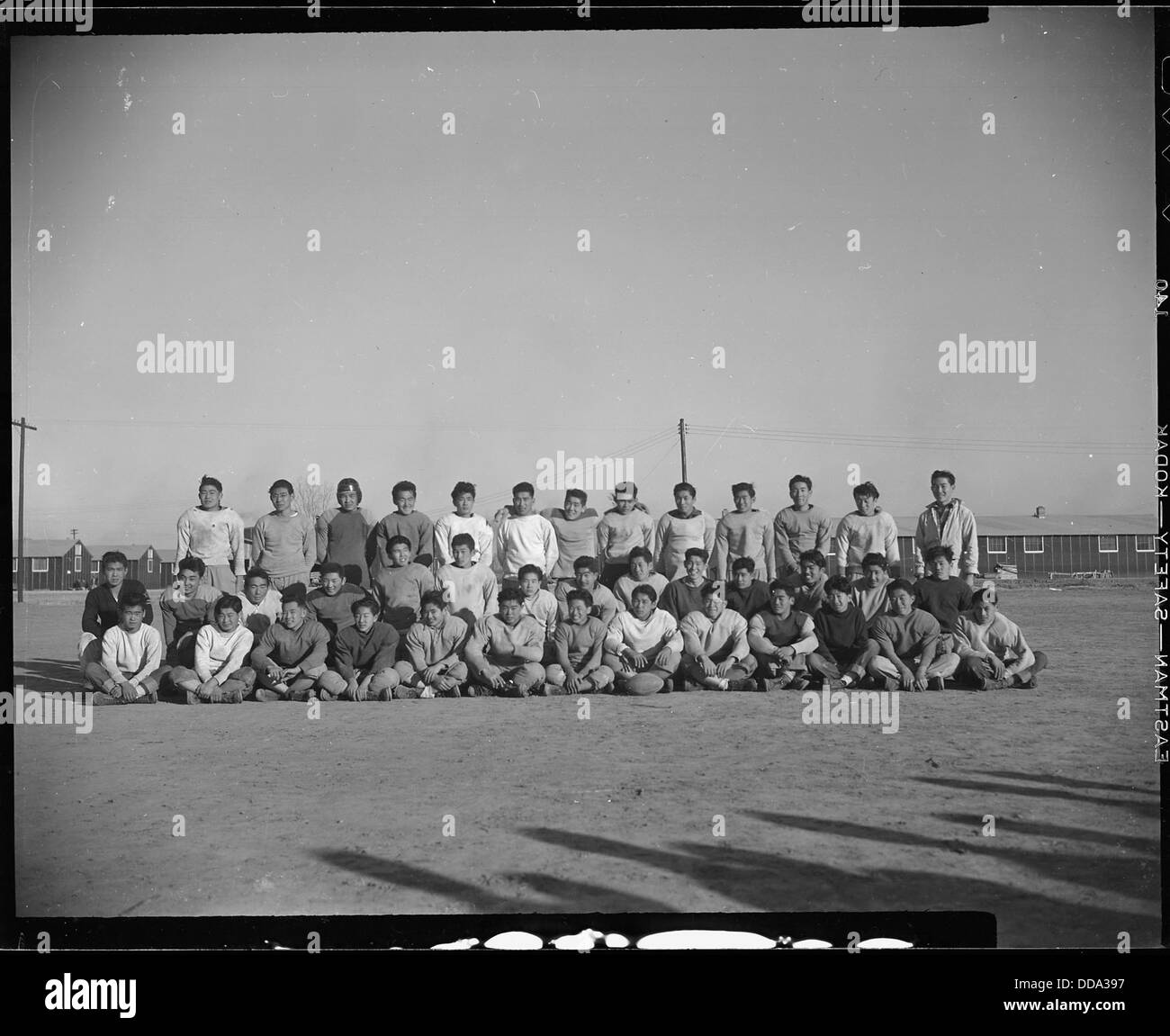 This photograph shows a football squad at the Rohwer Relocation Center ...