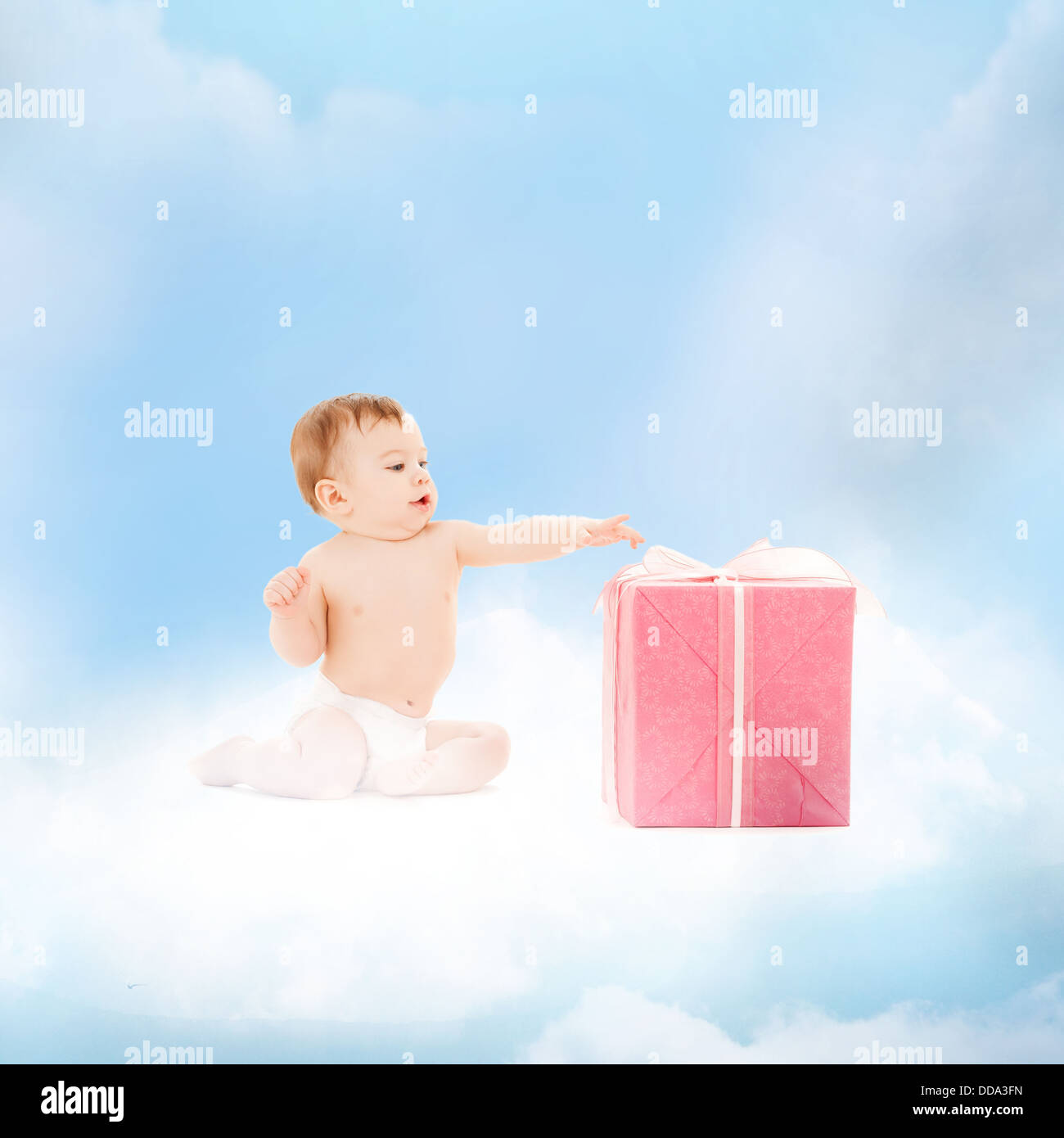 smiling baby with present on the cloud Stock Photo - Alamy